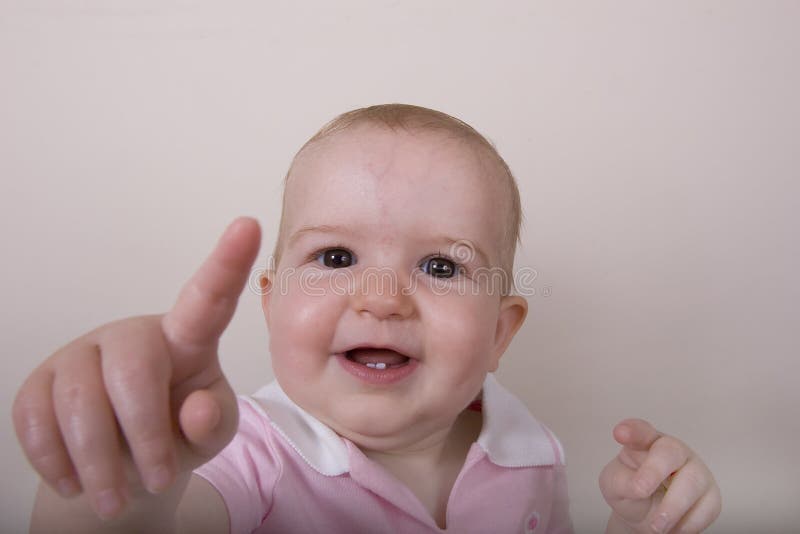 Baby Pointing at Camera stock photo. Image of close, born - 5675532