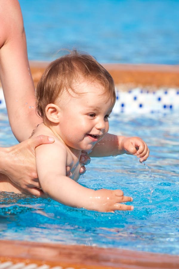 Baby in pool stock image. Image of laughing, face, human - 14325529
