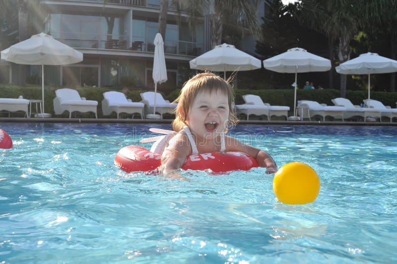 Baby in the pool stock image. Image of portrait, childhood - 97242601