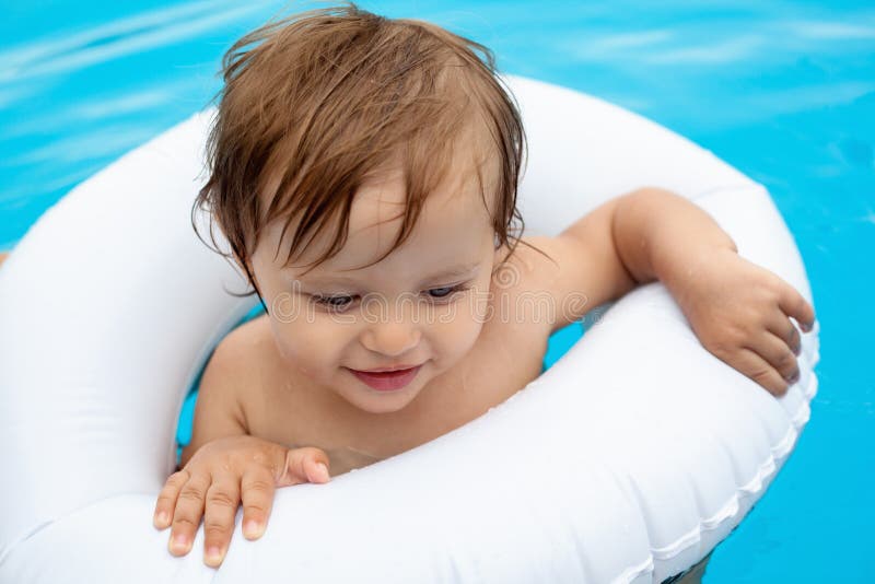 Baby in pool to swimming stock image. Image of love, learn - 76125463
