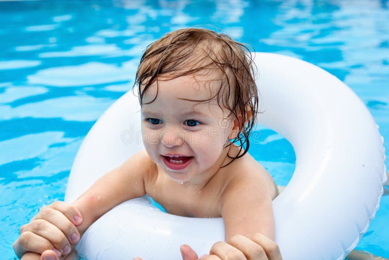 Baby in pool to swimming stock image. Image of lesson - 76125647