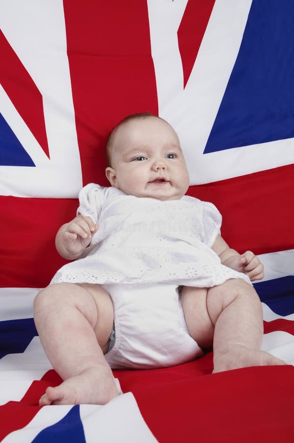 Baby propped up on a chair stock image. Image of caucasian - 15167675