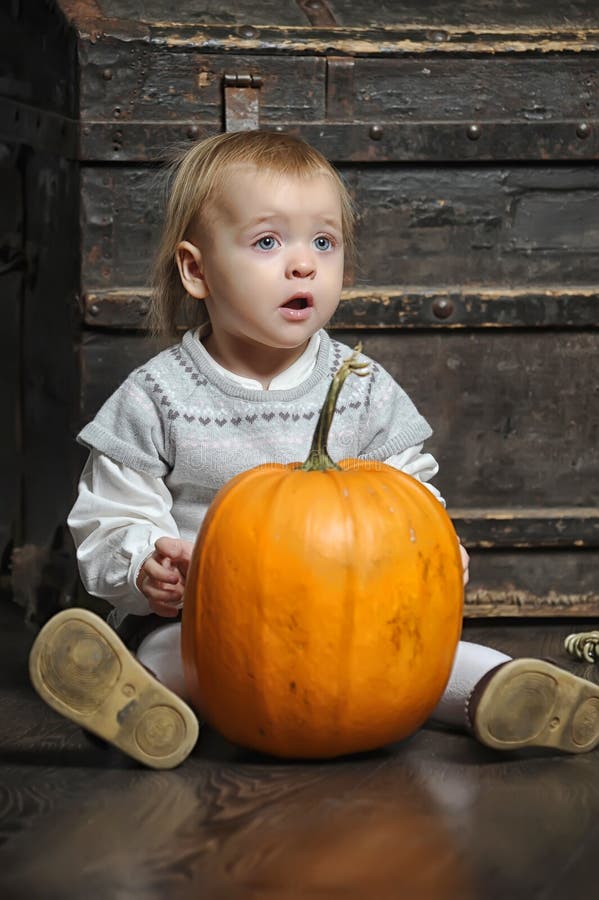 Baby with pumpkins stock image. Image of happy, laughing - 28241195