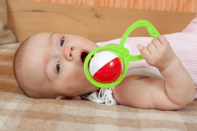 Baby Boy Playing with a Rattle Stock Image - Image of healthy ...