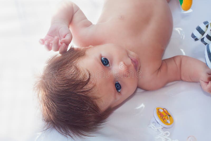 Baby with rattle stock image. Image of rattle, born, family - 32888963