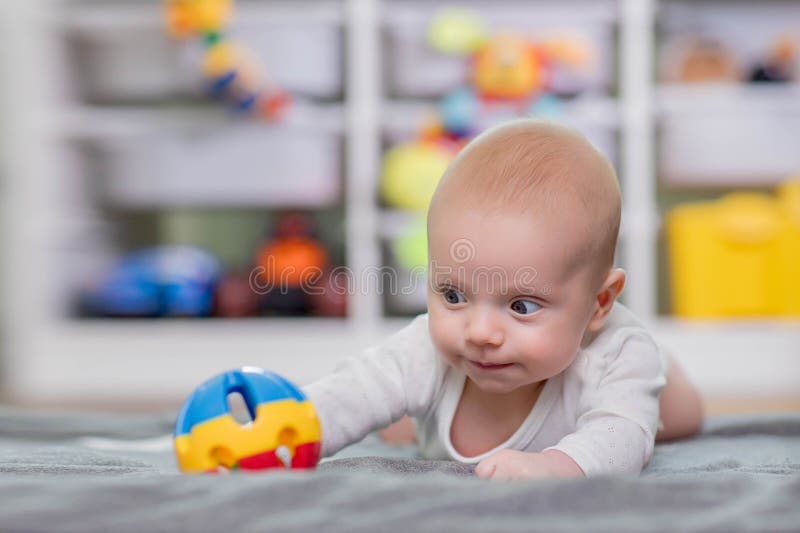 Baby Reaching for Toy. Baby Development Stock Image - Image of lovely ...