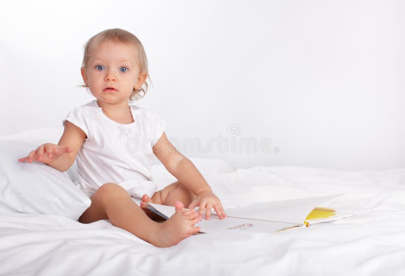 Baby reading book stock image. Image of months, small - 18457517
