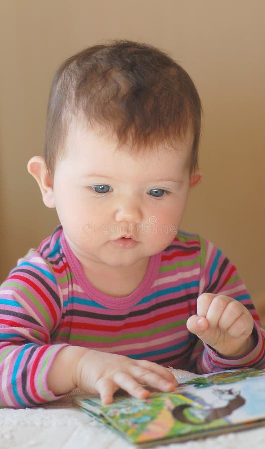 Baby , reading the book stock image. Image of female, innocent - 9856631