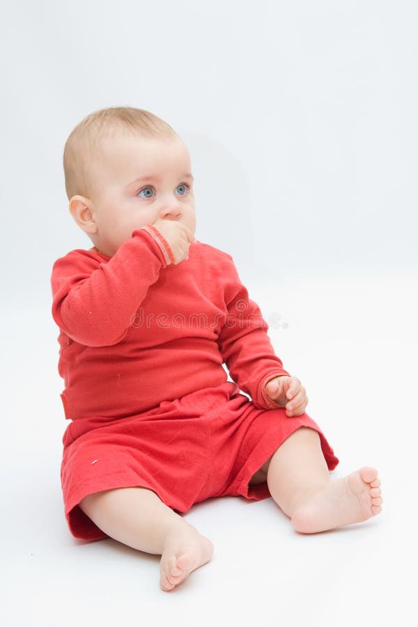Baby in red stock image. Image of thumb, sweet, baby, child - 6804545