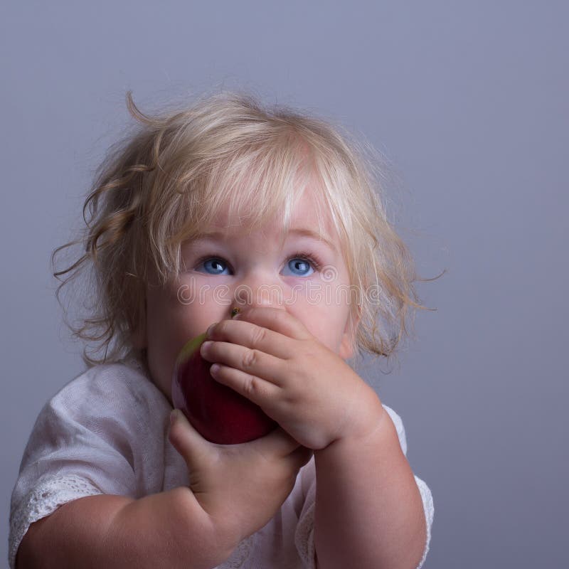 Baby a red apple stock photo. Image of baby, female, fruit - 63314574