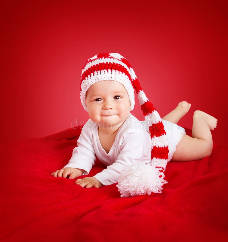 Baby in Red White Knitted Hat Stock Photo - Image of holiday, baby ...