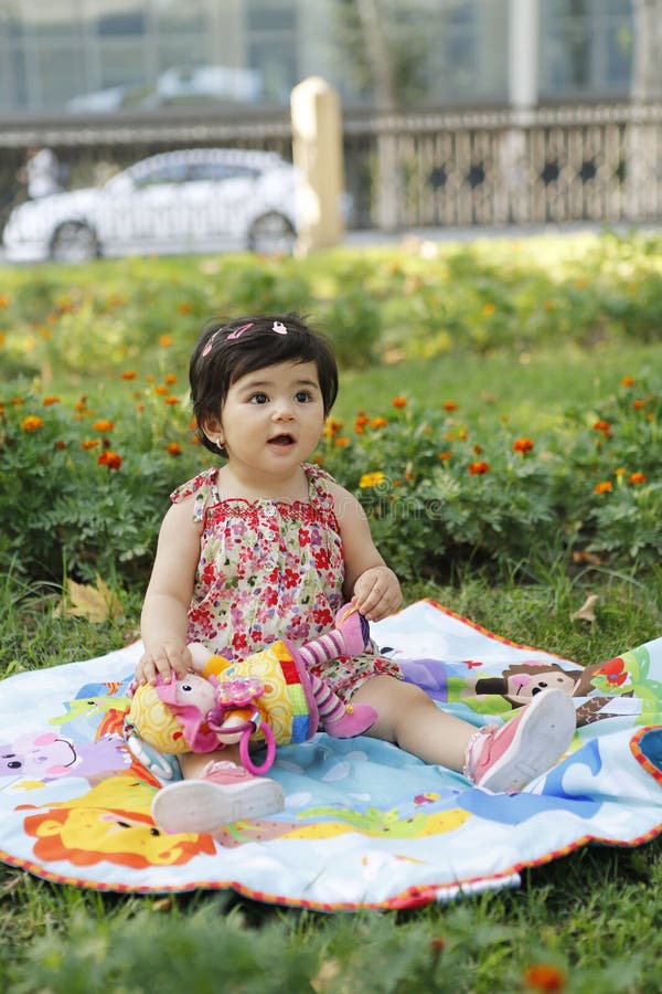 Baby Relax on Grass with Toys Stock Photo - Image of green, positive ...
