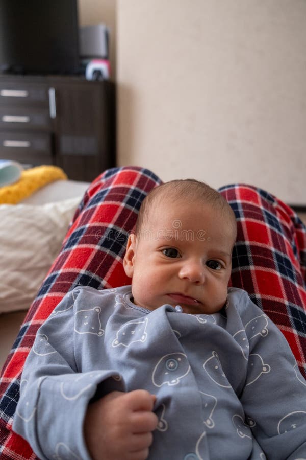 Baby Relaxing on Lap in Cozy Home Setting Stock Image - Image of ...