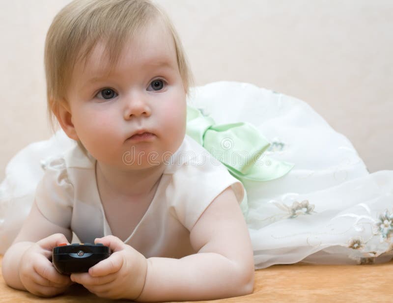 Baby boy with TV remote stock photo. Image of brown, child - 19347938