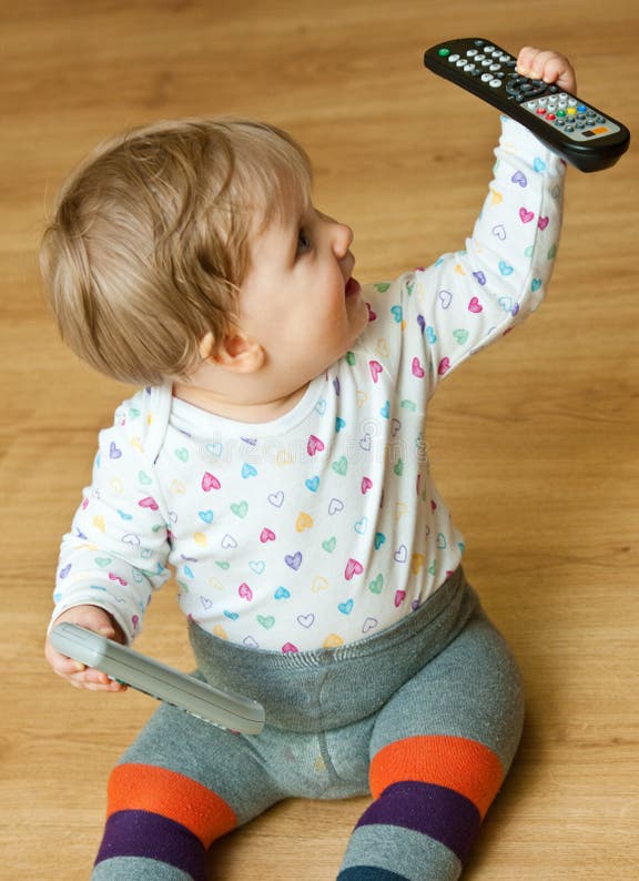 Baby with Remote Controllers Stock Image - Image of cute, television ...