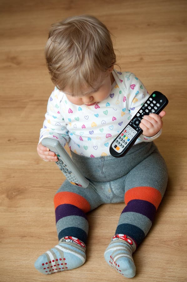 Baby girl watching tv stock image. Image of cheerful - 17019703