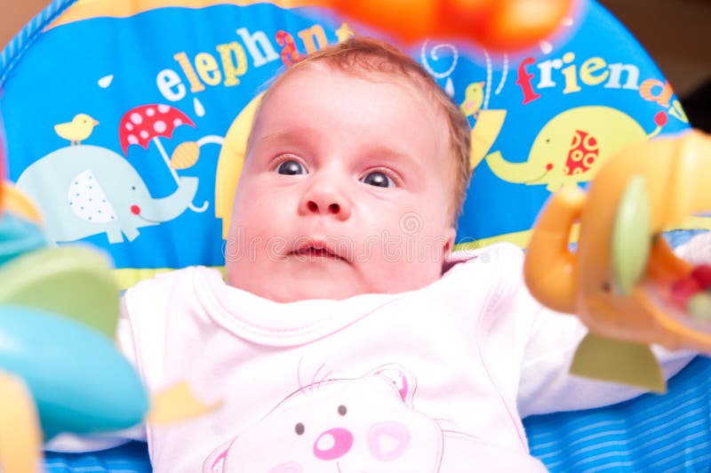 Baby on rocker stock image. Image of lovely, rocking - 14395479