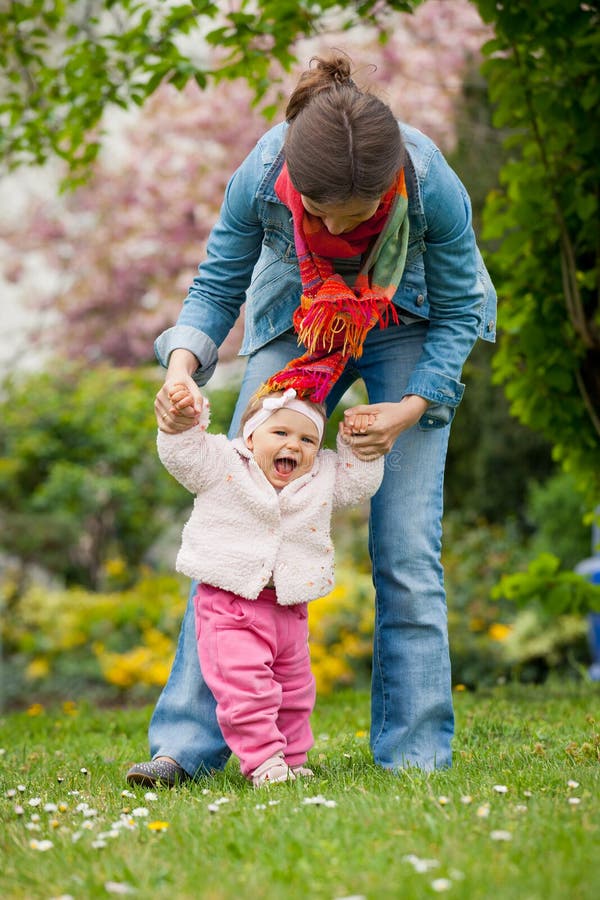 Baby s first steps stock image. Image of baby, flowers - 25866223