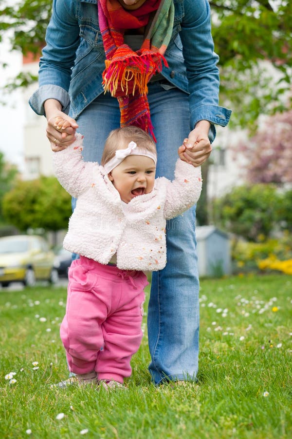 Baby s first steps stock photo. Image of cute, childcare - 26055308