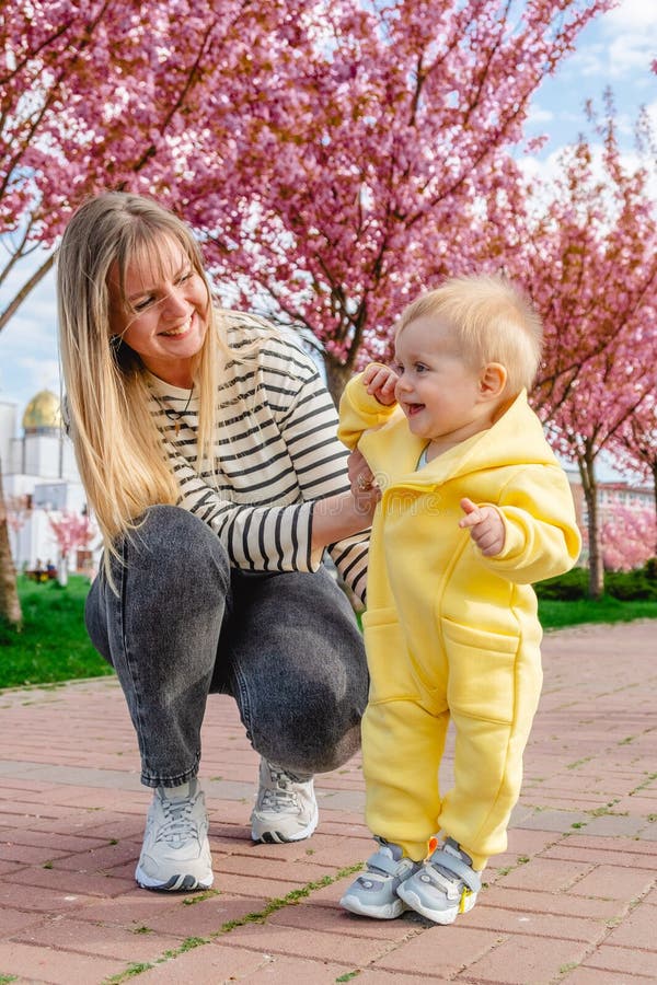 Baby S First Steps with Loving Mother S Help Stock Image - Image of ...