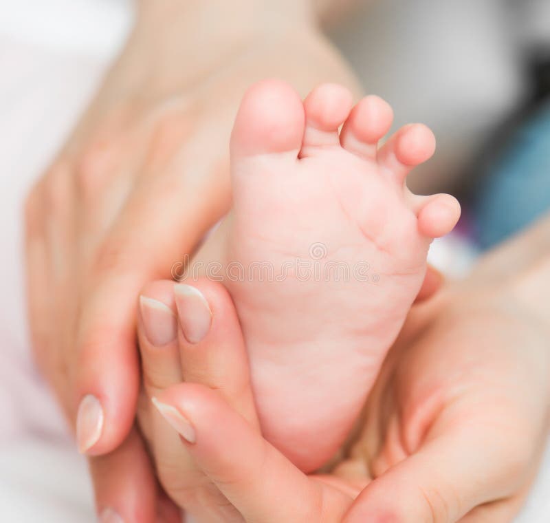 Baby s foot stock photo. Image of person, parent, caucasian - 30485492