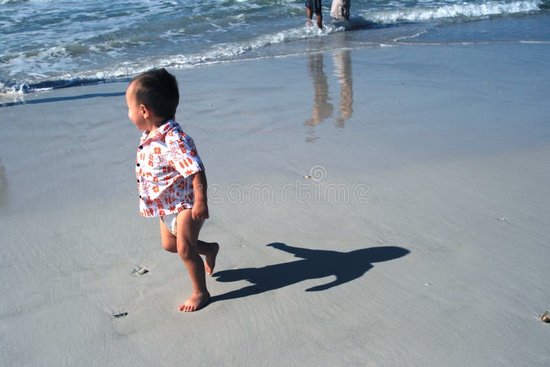 Baby s Shadow on Beach stock photo. Image of running, child - 1794934