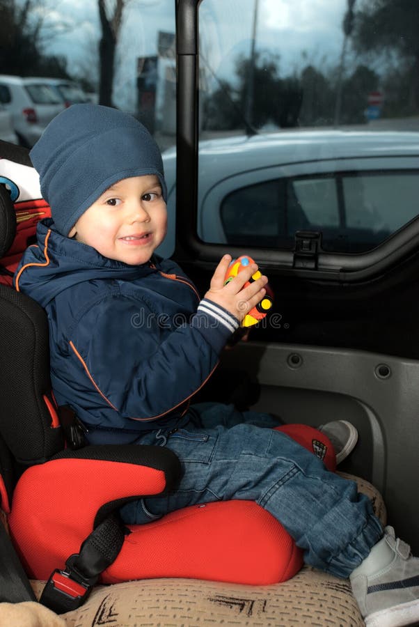 Baby in a safety car seat. stock image. Image of inattentive - 32775257