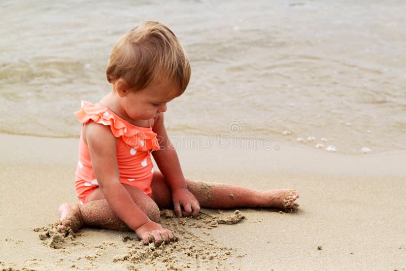 Baby on a sand beach stock photo. Image of edge, holidays - 51005238