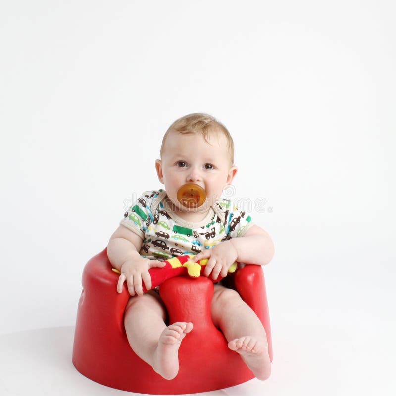 Baby sat in cosy chair stock image. Image of male, sitting - 24549451