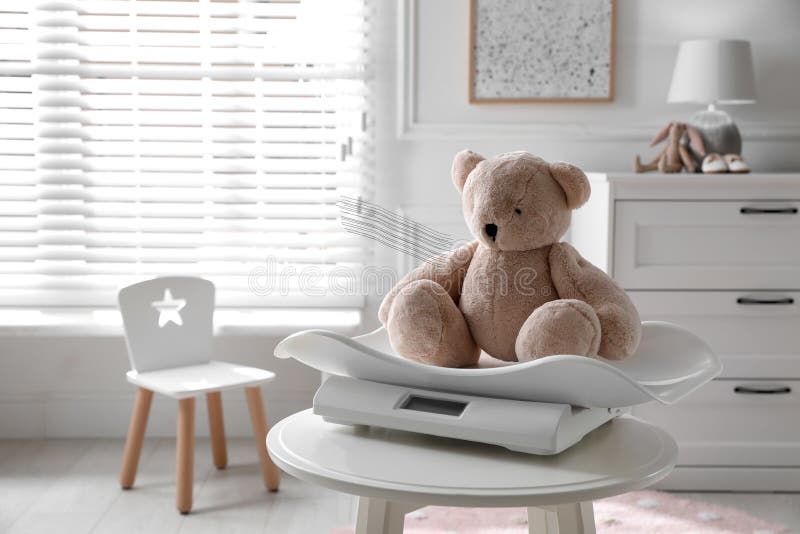 Baby Scales with Teddy Bear on Table in Room Stock Photo - Image of ...
