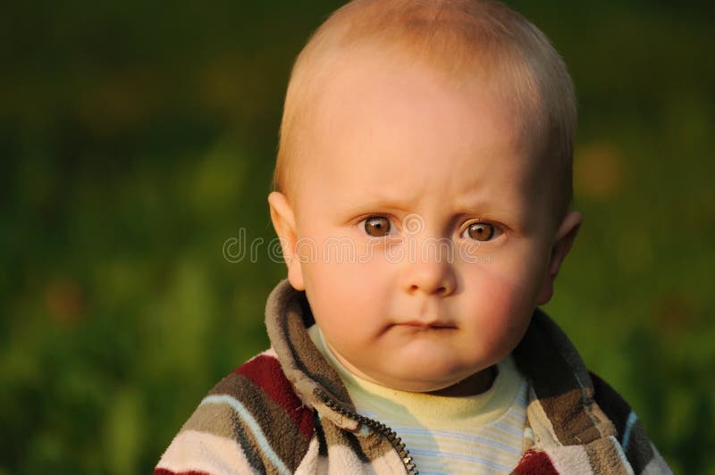 Baby with Serious Expression Stock Photo - Image of serious, staring ...
