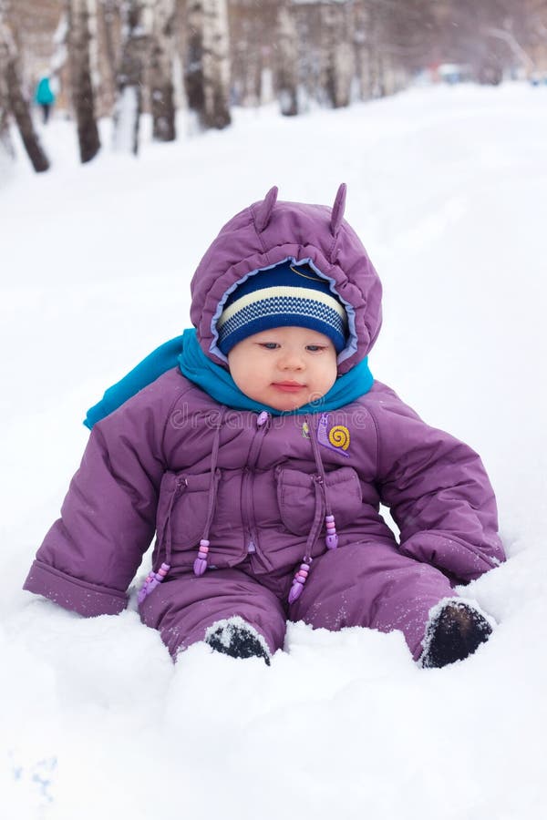 Baby sits in the snow stock image. Image of skates, sculpt - 17252037