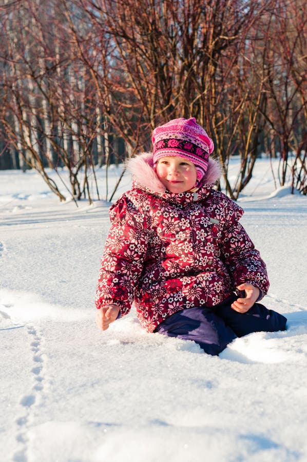 Baby Sits on Snow and Looks Stock Image - Image of child, small: 23078121