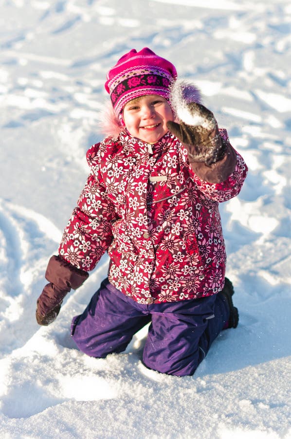 Baby Sits on Snow and Smile Stock Photo - Image of childhood, purple ...