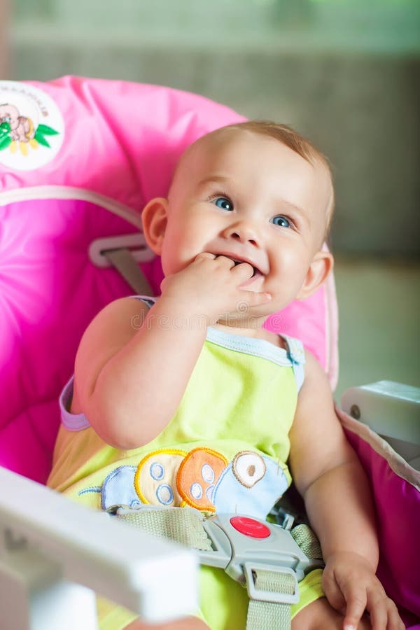 Baby Sitting in a Chair for Feeding Stock Photo - Image of mouth, human ...