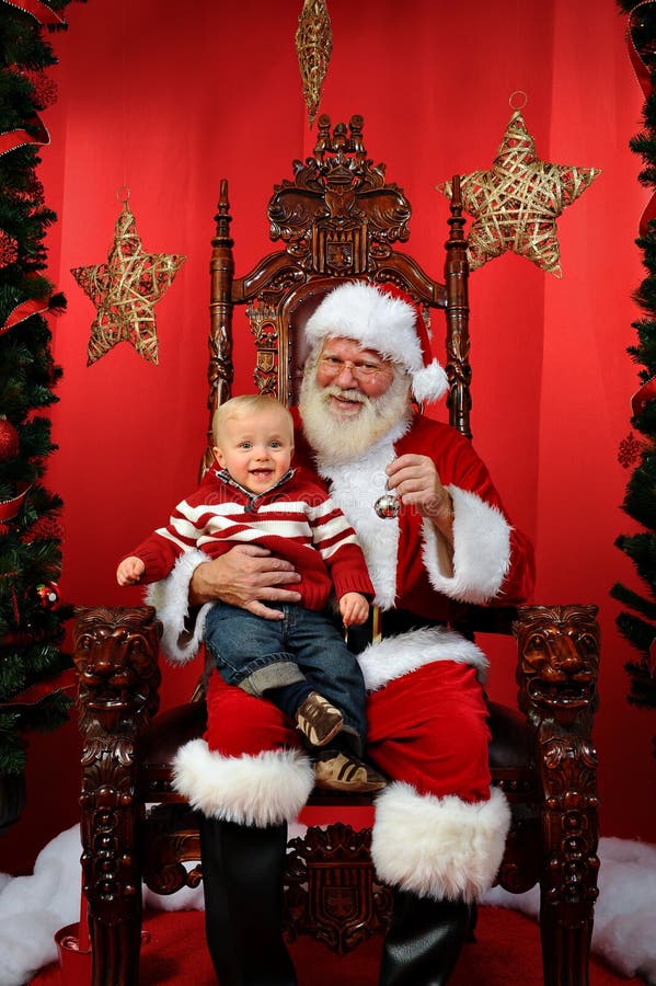 Baby Sitting on Santa S Lap Stock Image - Image of santa, looking: 22302591