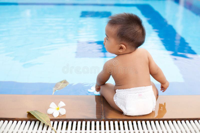 Baby Sitting Side of the Pool Stock Photo - Image of white, beautiful ...