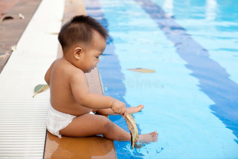 Baby Sitting Side of the Pool Stock Photo - Image of white, beautiful ...