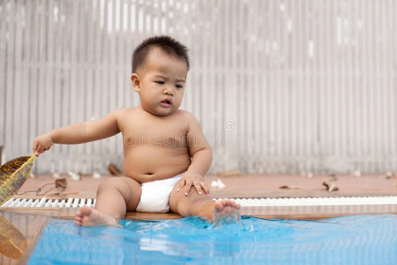 Baby Sitting Side of the Pool Stock Photo - Image of smiling, angelic ...