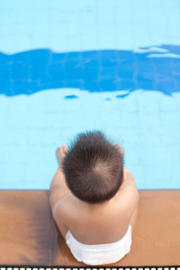 Baby Sitting Side of the Pool Stock Photo - Image of white, beautiful ...