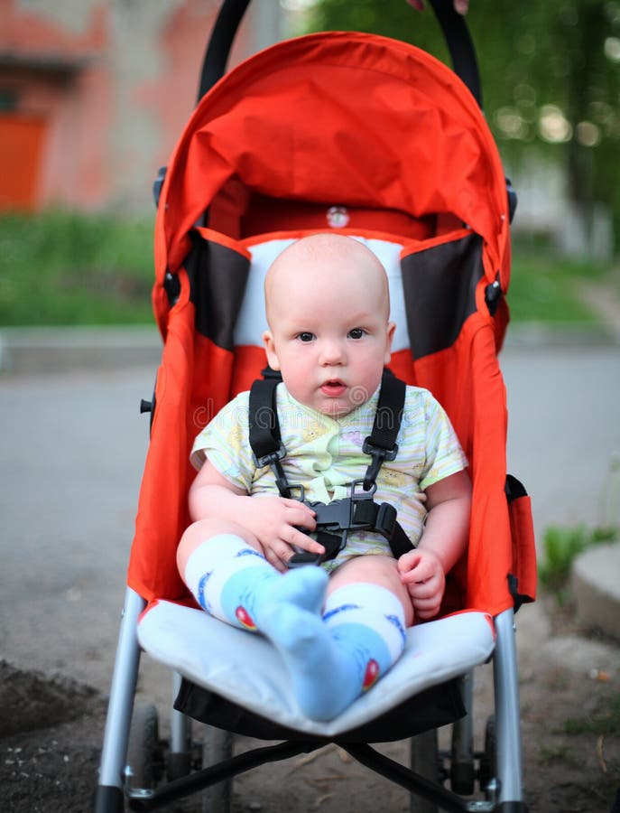 Baby in sitting stroller stock image. Image of orange - 4337541