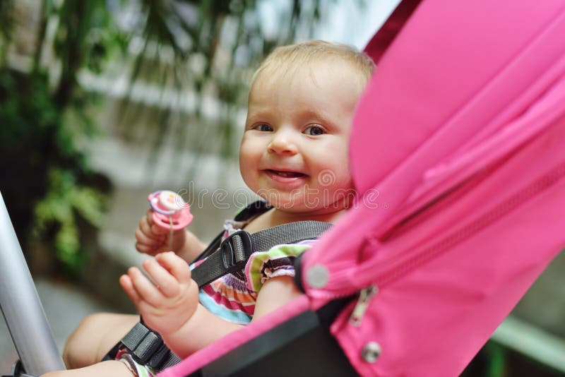 Baby Sitting in the Stroller Stock Photo - Image of cheerful, love ...