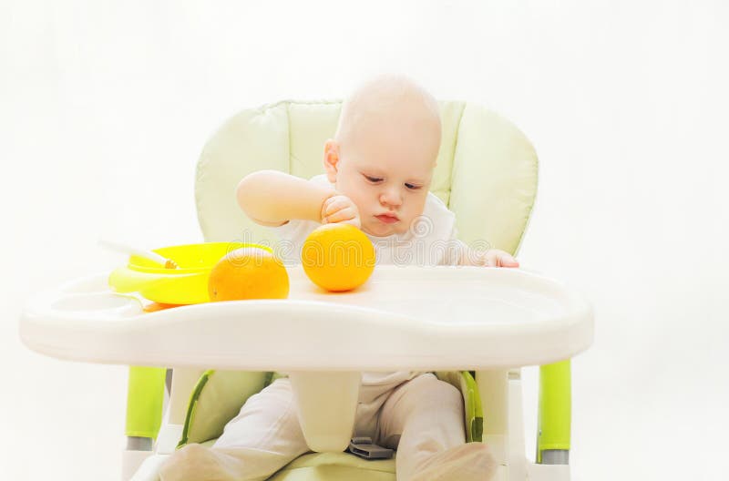 Baby Sitting at Table with Fruits Home Stock Image - Image of food ...