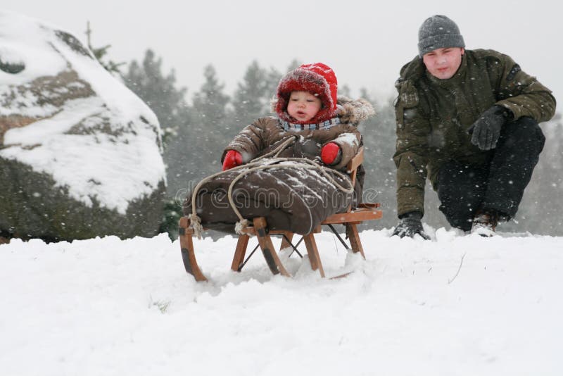 Baby and mom sledding stock photo. Image of riding, seasons - 12385514