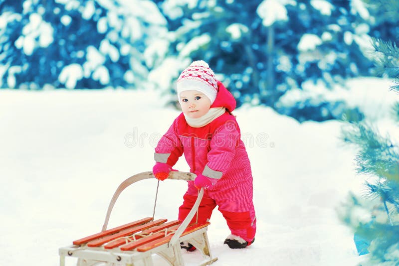 Baby and mom sledding stock photo. Image of riding, seasons - 12385514