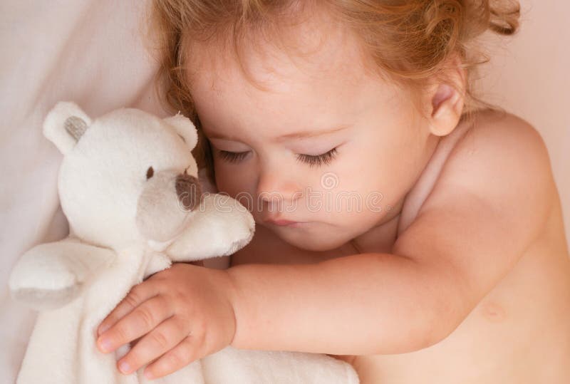 Baby Sleeping in the Bed. Quiet Sleep with Teddy Bear. Stock Image ...
