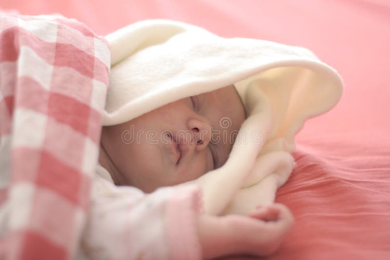Baby sleeping in red stock photo. Image of eyes, happy - 1285162