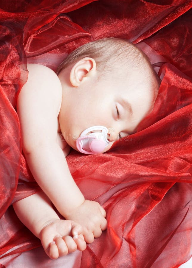 The Baby Sleeping and Wrapped Up in Red Calico Material Stock Photo ...