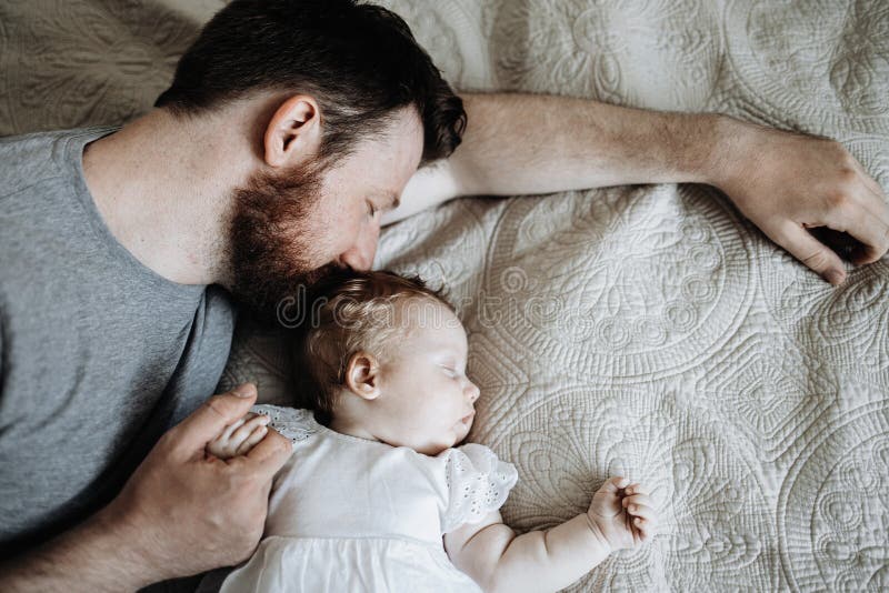 Baby sleeps with daddy stock photo. Image of childhood - 251546376