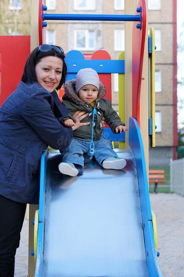 Baby on slide stock photo. Image of baby, mother, woman - 54314886